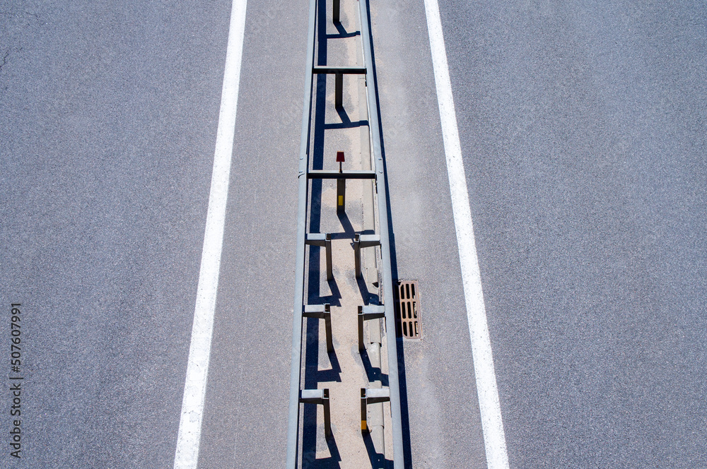 Top view of the road markings on the asphalt road highway. Metal ...