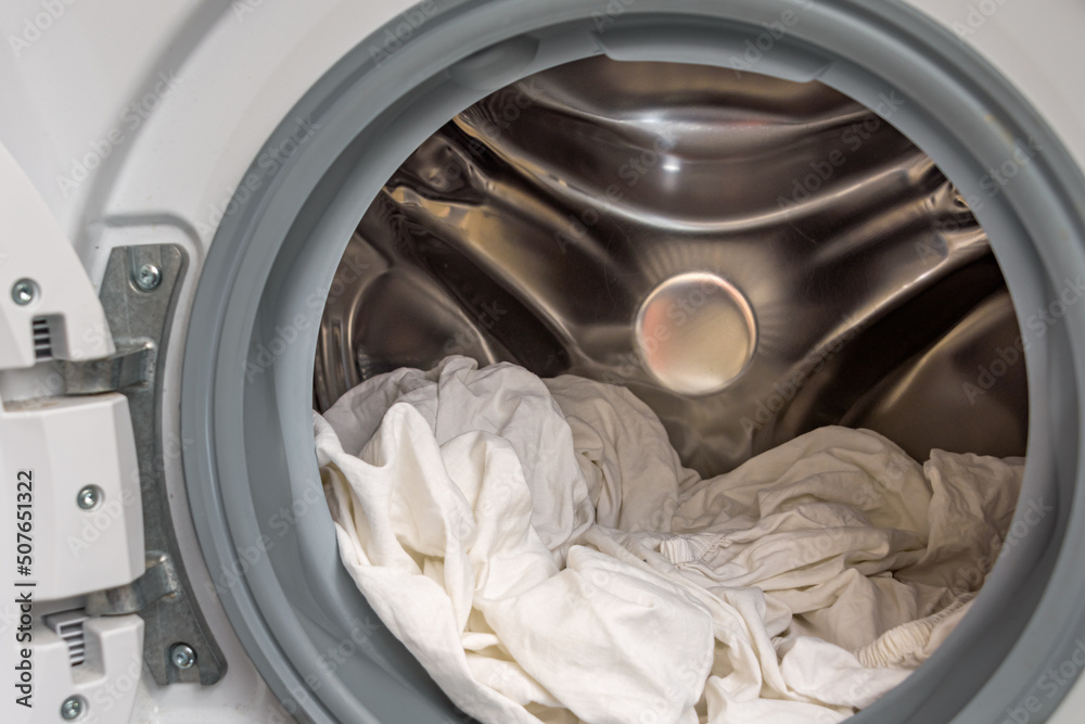 White clothes in a open washing machine Stock Photo | Adobe Stock
