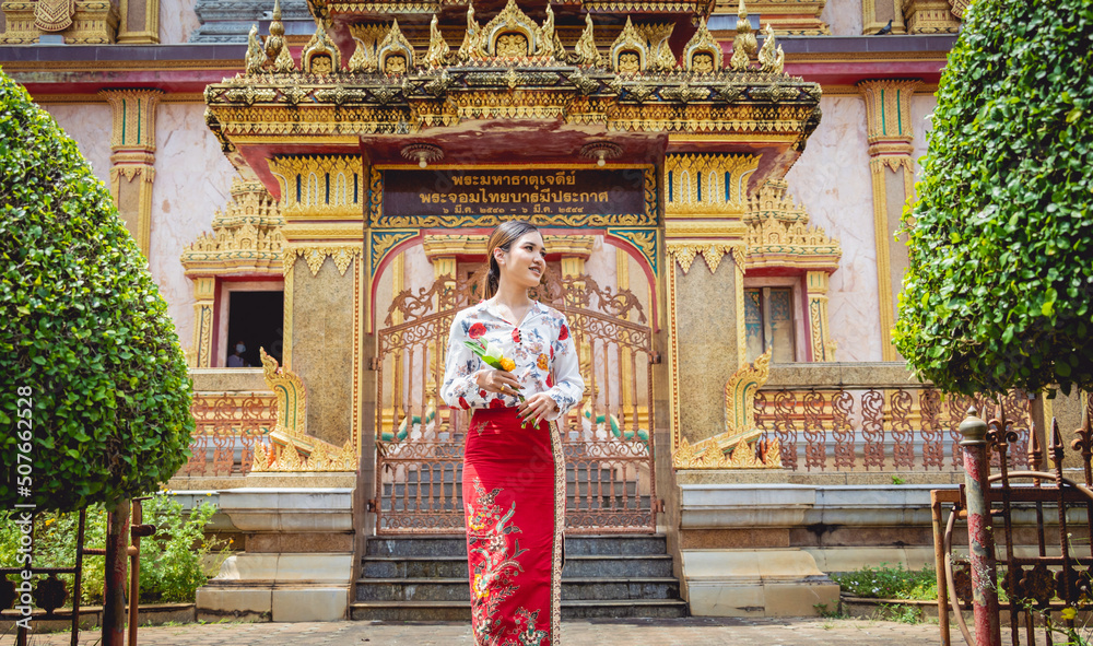 Beautiful Asian girl at big Buddhist temple dressed in traditional ...