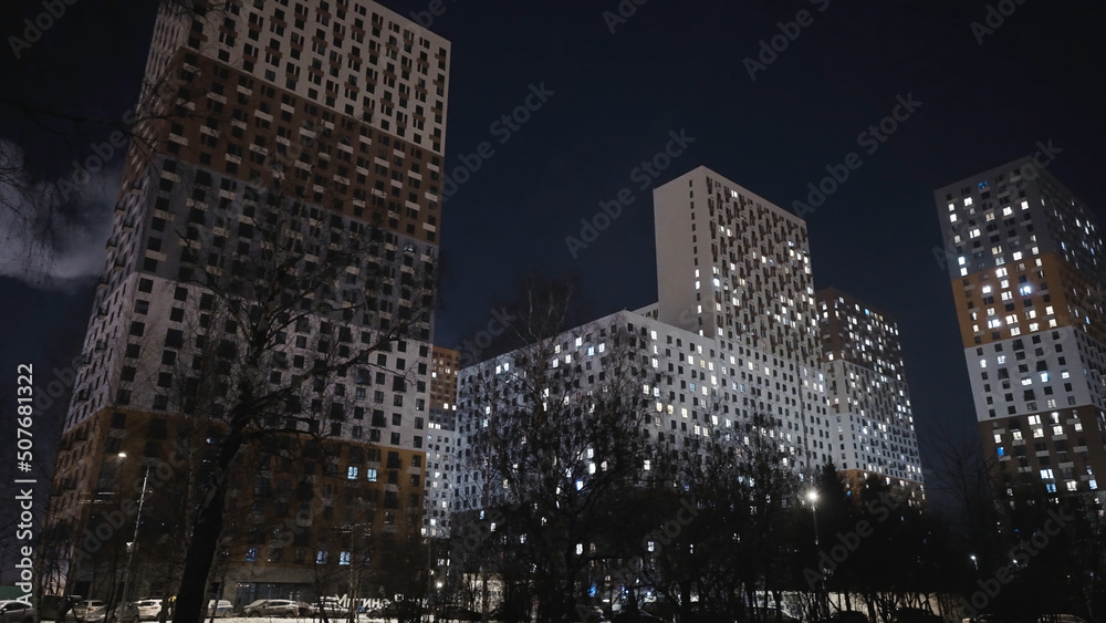 Beautiful residential buildings on background of night sky. Action ...