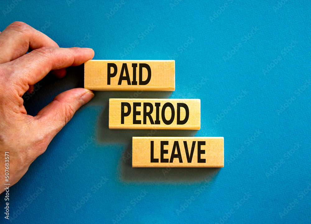 Paid period leave symbol. Concept words Paid period leave on wooden ...