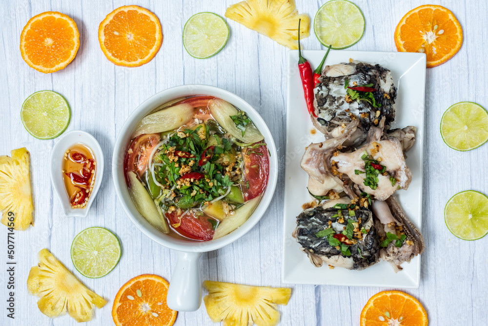 Vietnamese family food. Sour soup bowl of snakehead fish is rich in ...