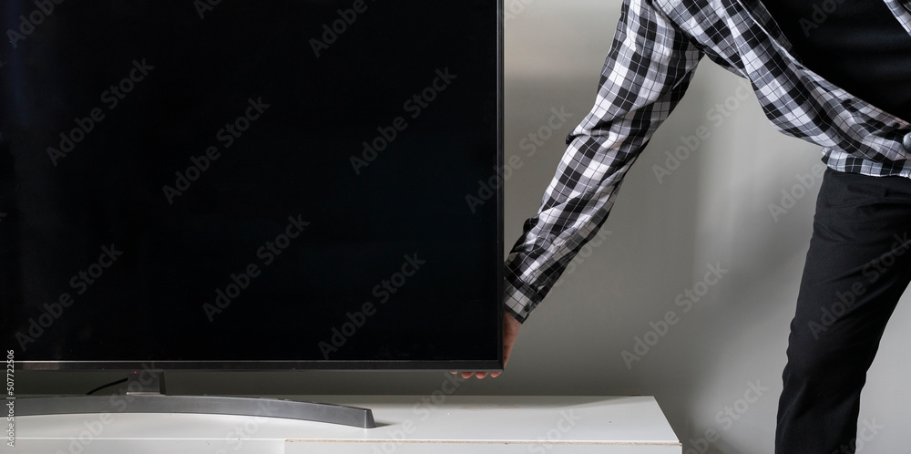 person push the button to turn on the monitor Stock Photo | Adobe Stock