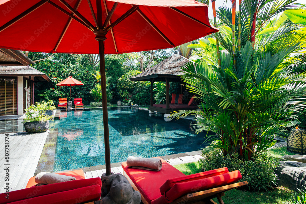 Indonesia, Bali, Poolside of luxurious villa in summer Stock Photo ...