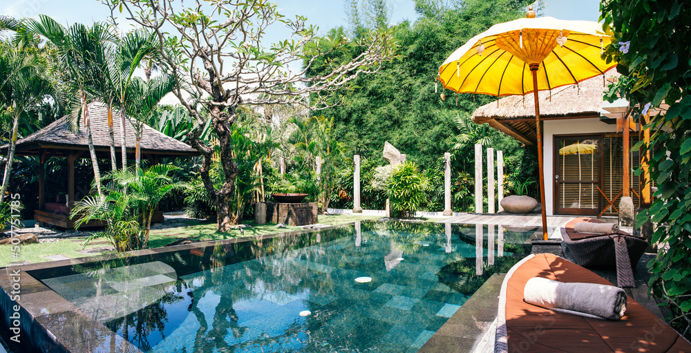 Indonesia, Bali, Panoramic view of poolside of luxurious villa in ...