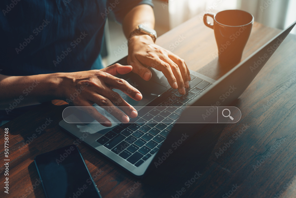 Data search technology search engine optimization with blank search bar, man hands working with ...