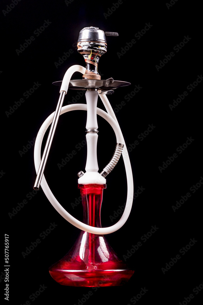 kolyan. on a black background. a vessel made of red glass and a white ...