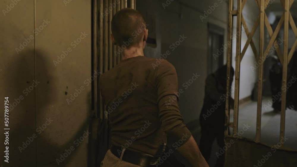 Locked down of young Caucasian woman with shaved head running away ...