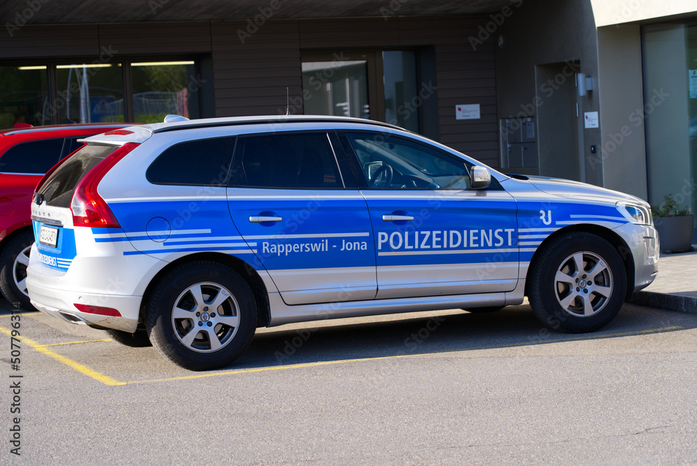 Blue and silver parked police car at City of Jona on a sunny spring day ...