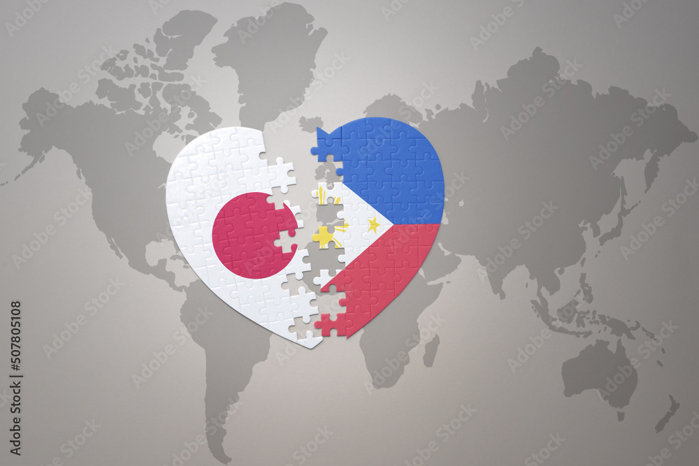 puzzle heart with the national flag of japan and philippines on a world ...
