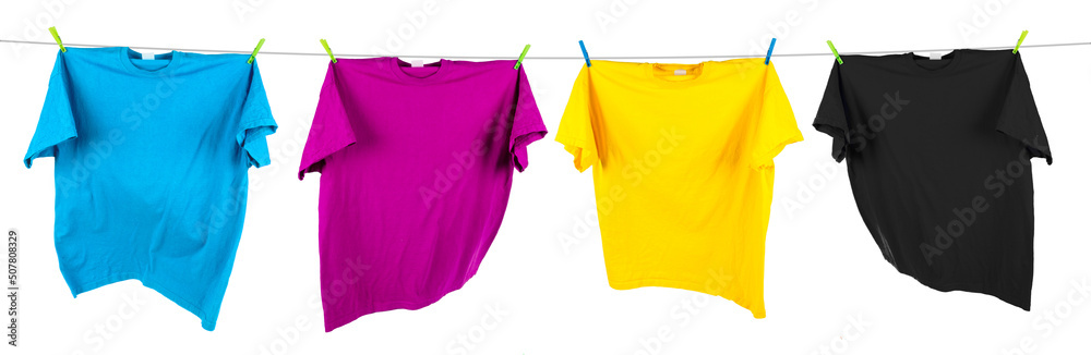Colorful CMYK colored t-shirts on clothes line isolated white ...