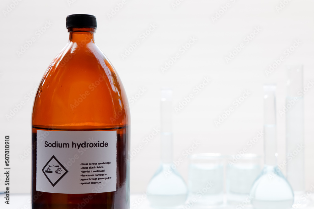 Sodium hydroxide in bottle, chemical in the laboratory Stock Photo ...