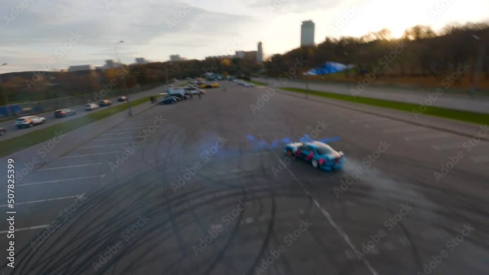 Race drone chasing sport car doing skids on private tunning event ...