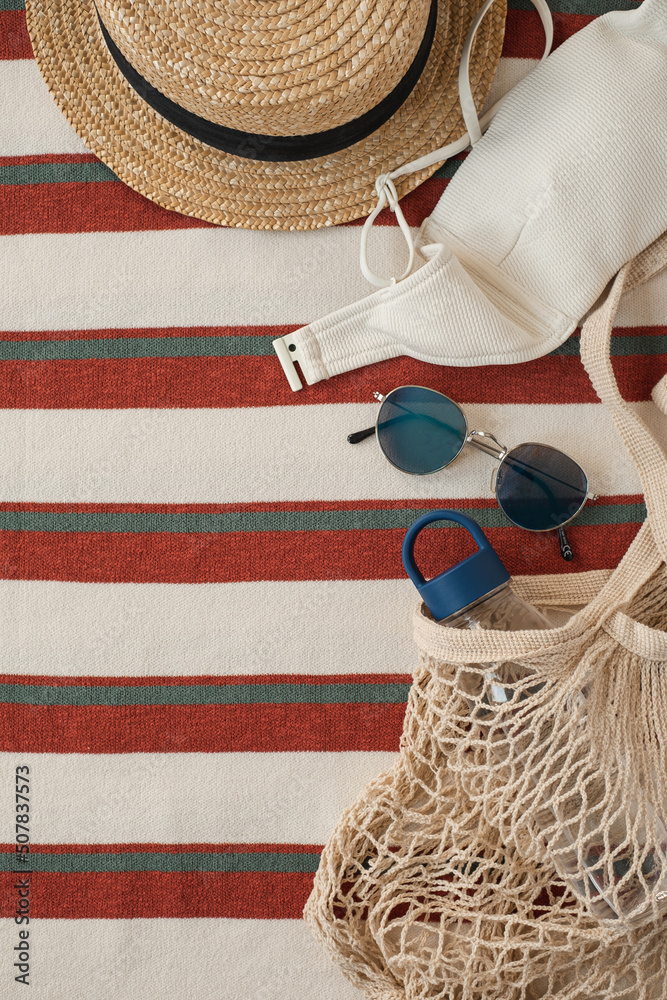 Top view of women's clothes and accessories for summer vacation beach ...