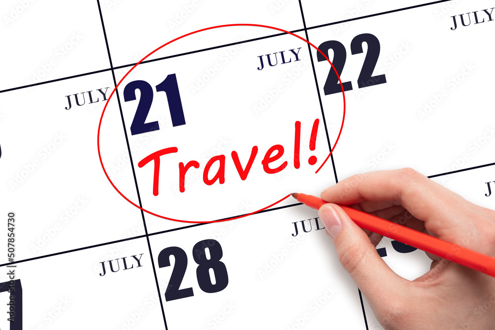 21st day ofJuly. Hand drawing a red circle and writing the text TRAVEL ...