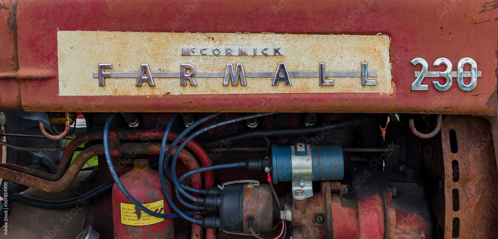 Tractor logo for a McCormick Farmall 230 on a vintage, antique tractor ...