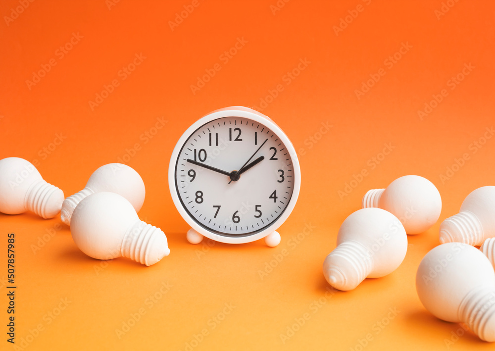Time,dateline and creativity concepts with group of lightbulb and clock ...