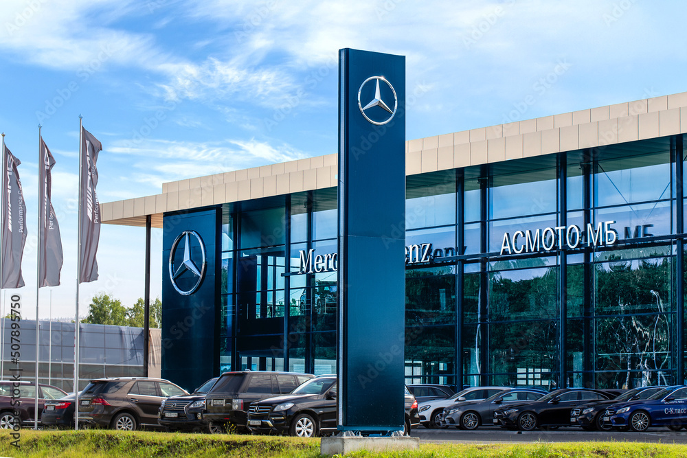 Mercedes-Benz dealership with a modern facade and cars on display in ...