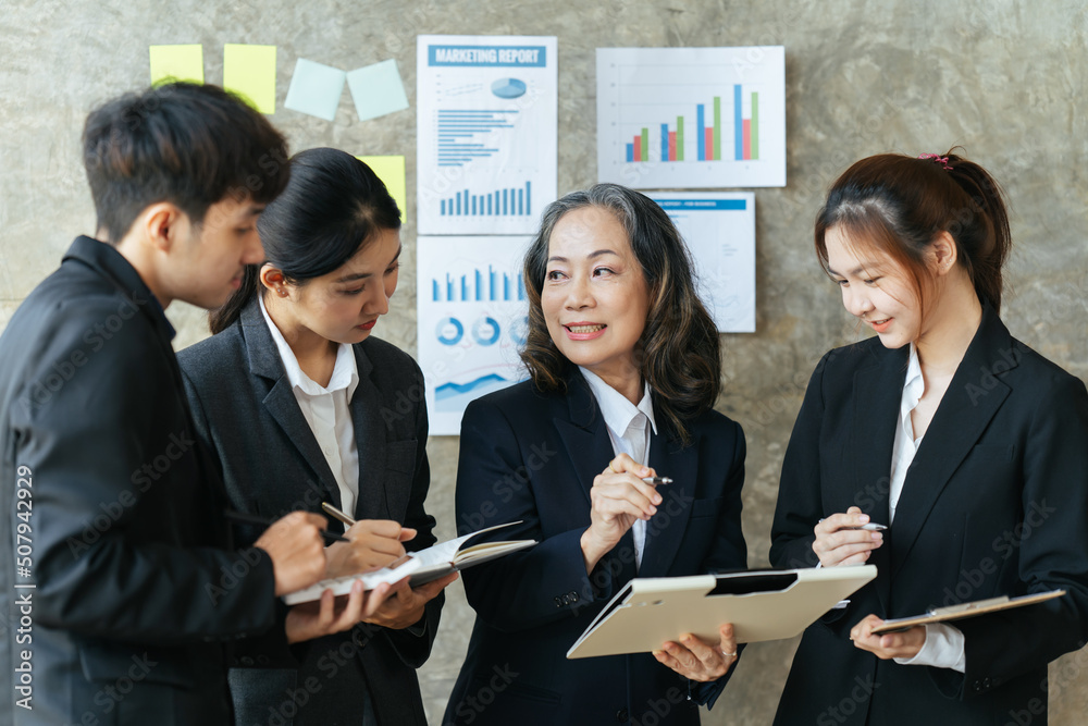 Asian business people working together in the office, Team leader ...