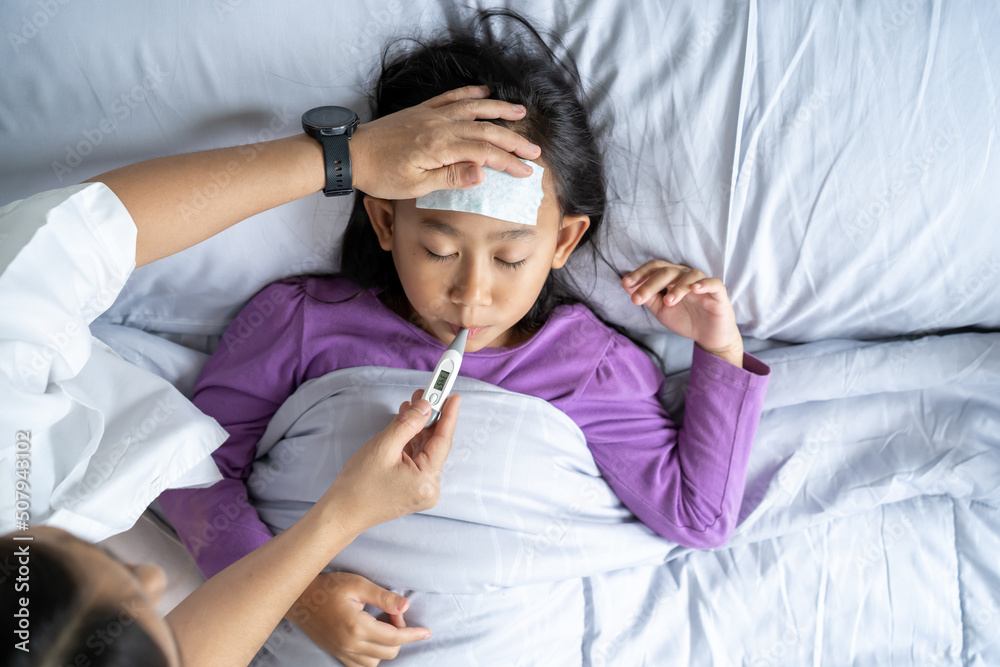 Top view mother is measure the temperature of Asian girl, Sick child ...