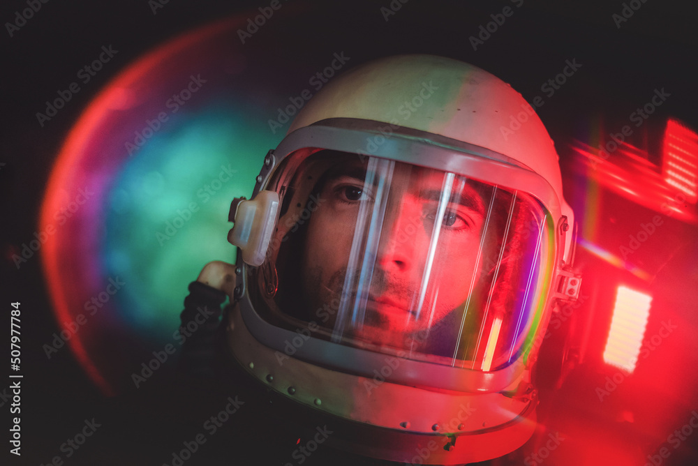 Spaceman in the in helmet and spacesuit on the blinking stars ...