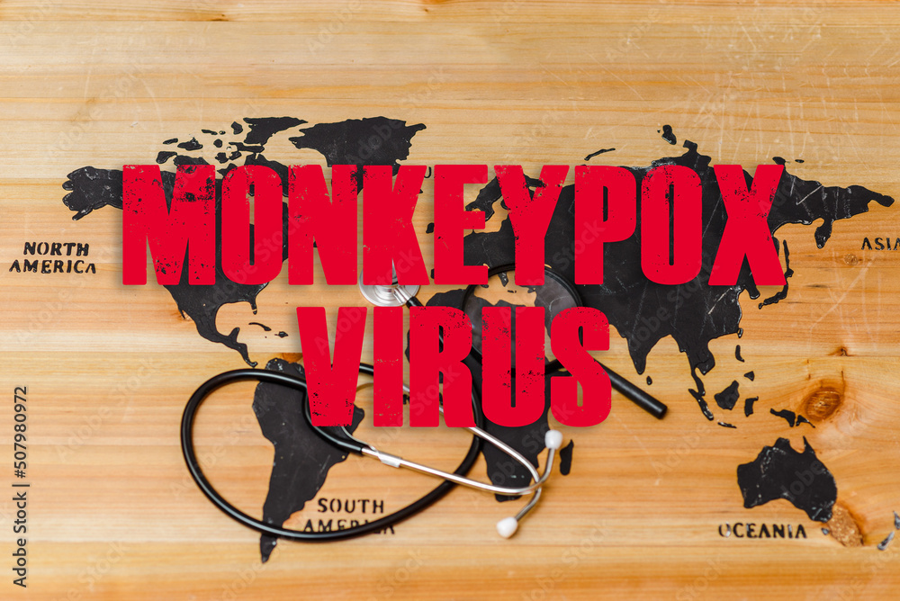 Inscription world wooden map,a stethoscope and a magnifying lip lie on ...