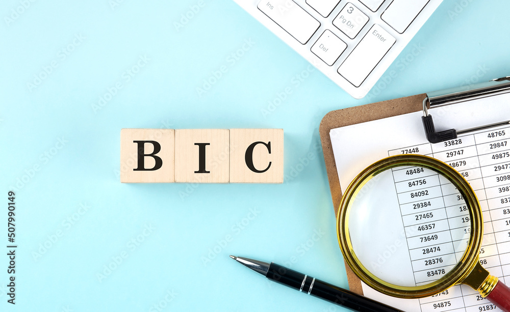 BIC Bank Identifier Code word on wooden cubes on blue background with ...