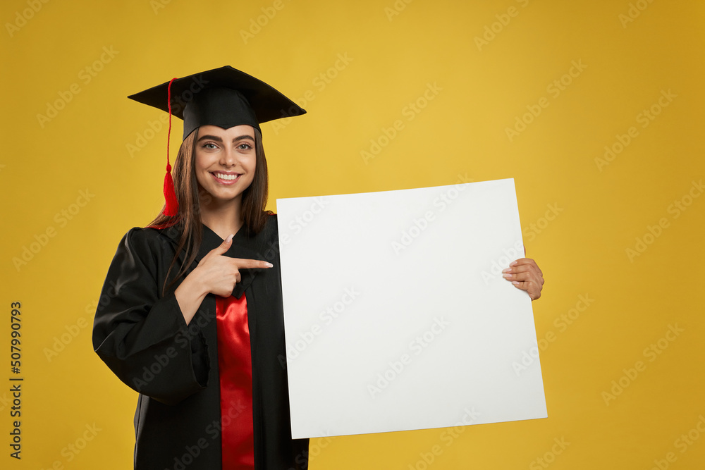 Front view of successful female standing, looking at camera, smiling ...