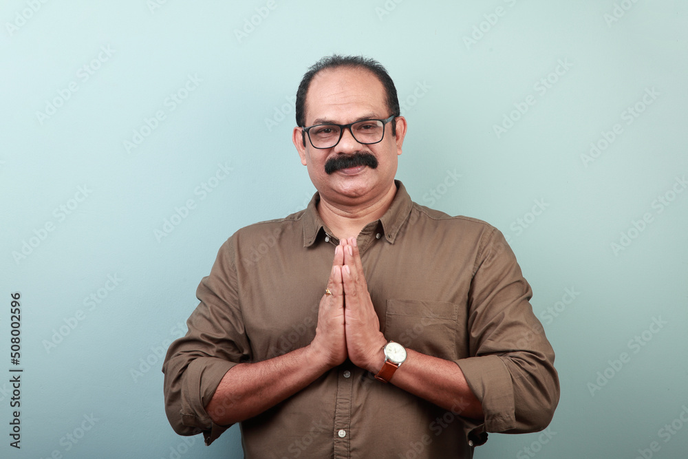 Poster Portrait of a middle aged man of Indian ethnicity shows ...