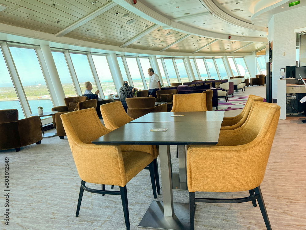 People in the lounge for suite level on the Royal Caribbean Mariner of ...