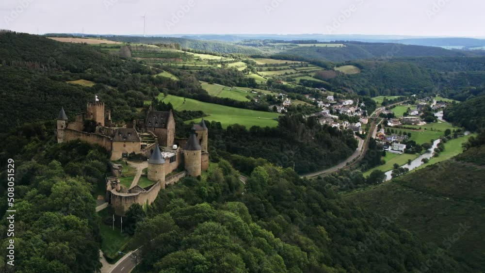 Castle Aerial View: Drone pans along the castle Bourscheid. On top of ...