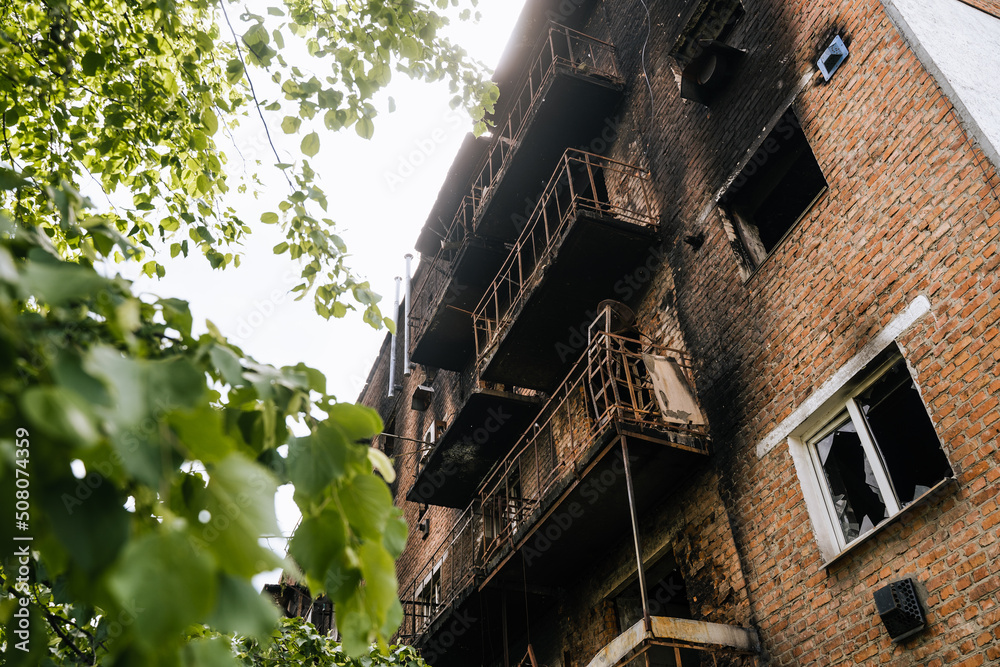 War in Ukraine. A burnt civilian house from the Russian military in the ...