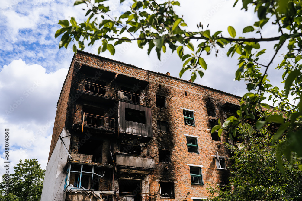 War in Ukraine. A burnt civilian house from the Russian military in the ...