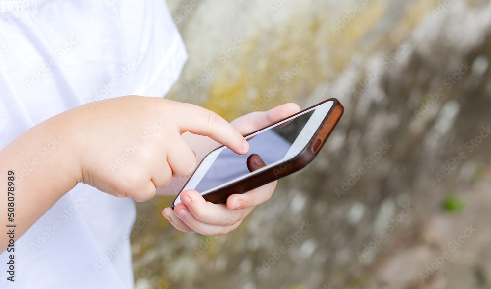 Anonymous school age girl, child using her mobile phone, smartphone ...