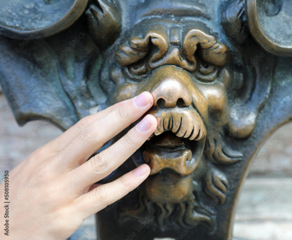 Hand and one of four Lions in Munich near Residenz Palace in the legend ...