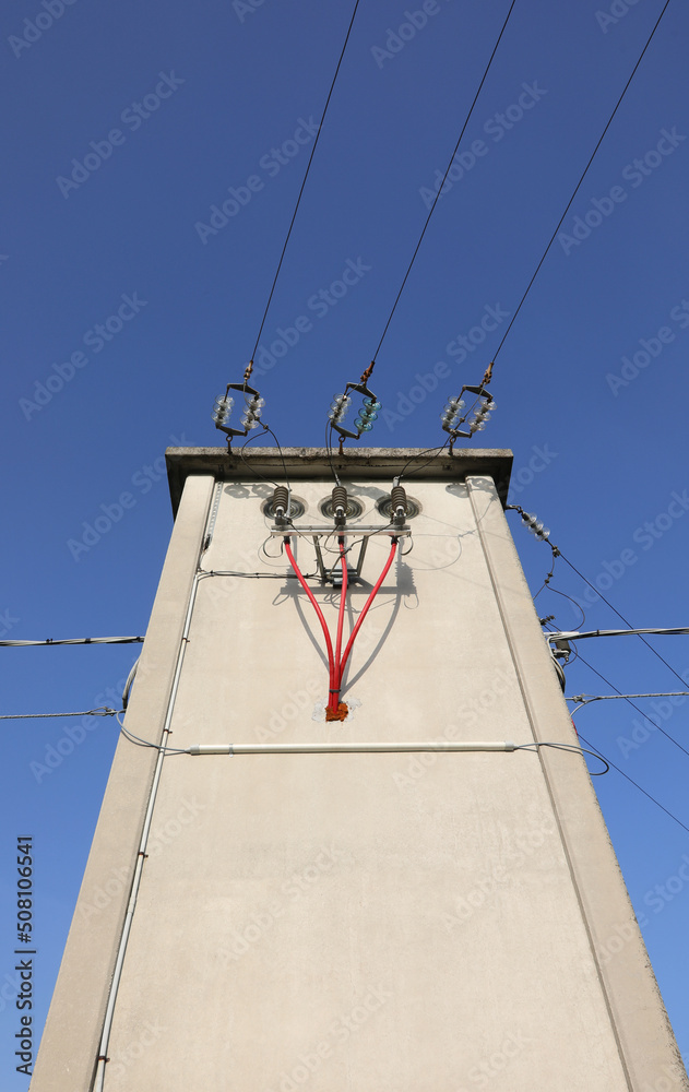 bare copper cables and insulated red electrical wires in the big ...