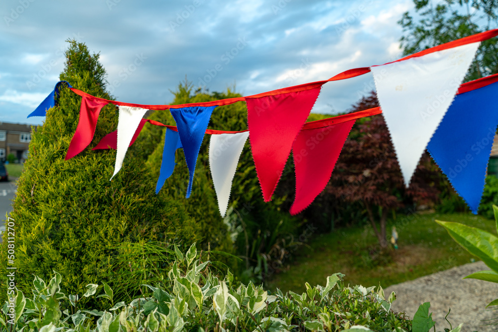 Bunting flags in colors of british flag, white, red and blue each in ...