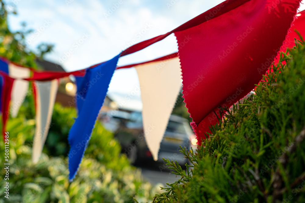Bunting flags in colors of british flag, white, red and blue each in ...