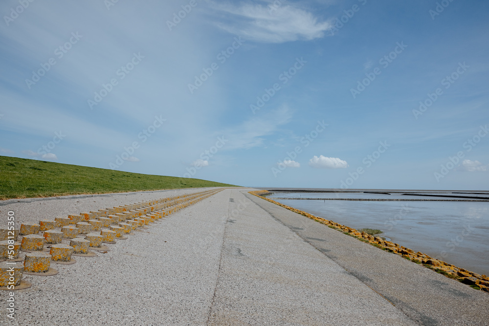 North Sea beach with fascines. Beach with dike at the North Sea in ...