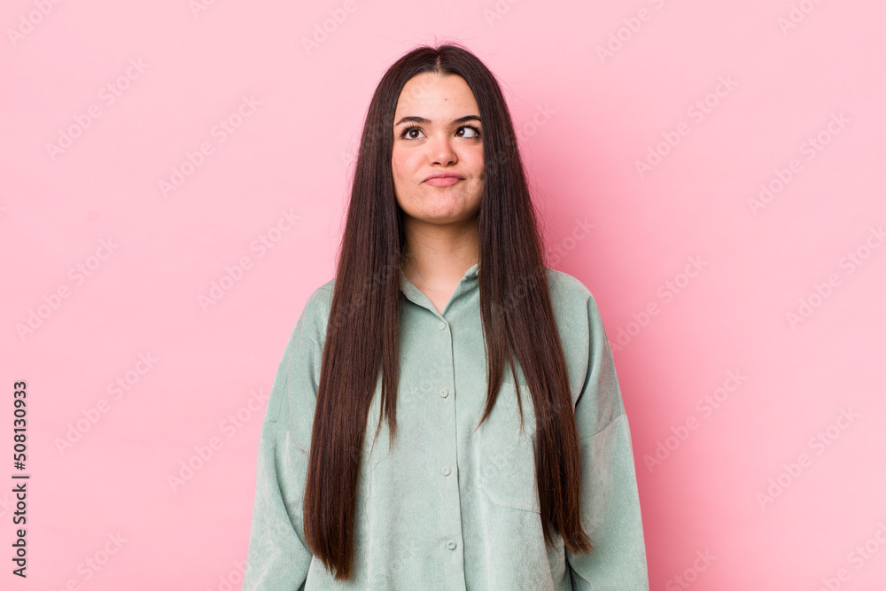 young adult woman looking goofy and funny with a silly cross-eyed ...