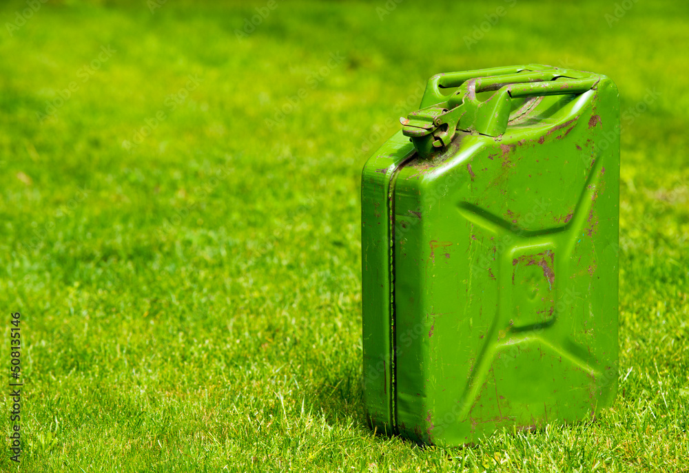 green fuel container on green grass Stock Photo | Adobe Stock