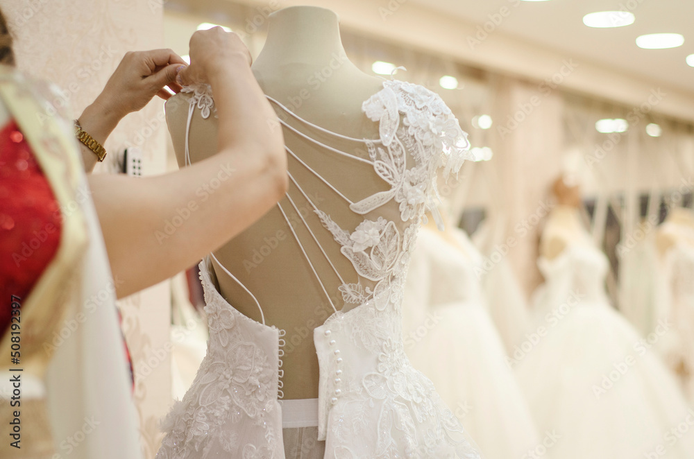 Foto de Fashion designer creating gowns stock photo do Stock | Adobe Stock