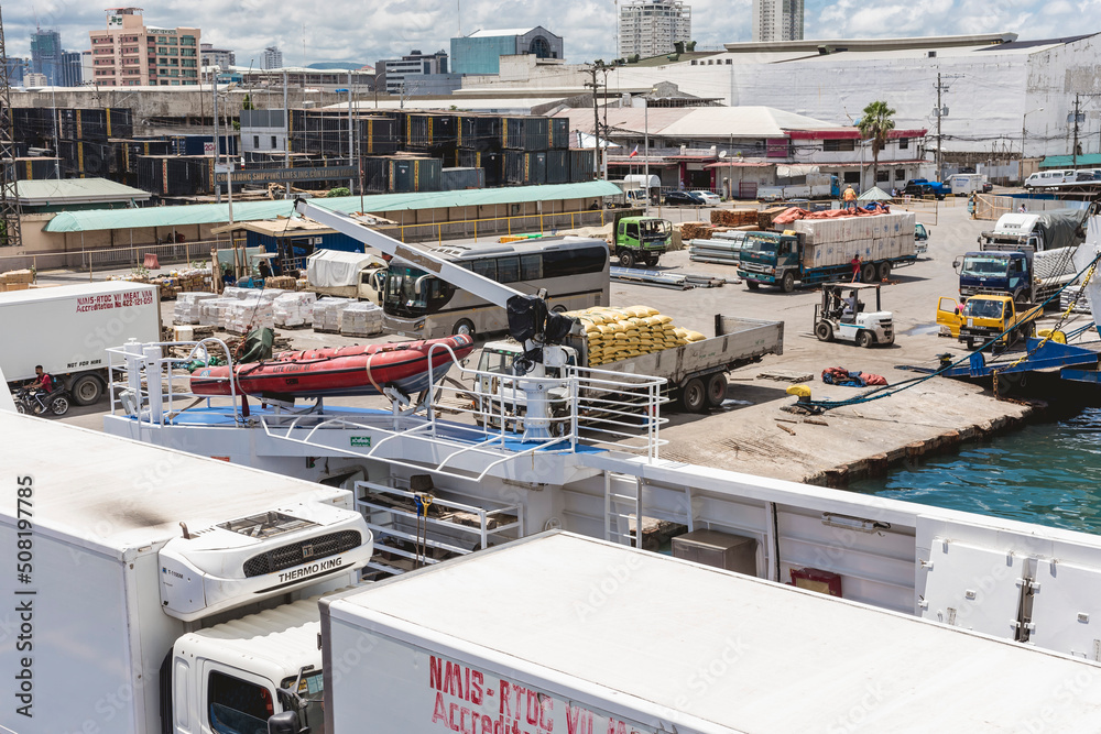 Cebu City, Philippines - A RORO ship loaded with cargo freight trucks ...