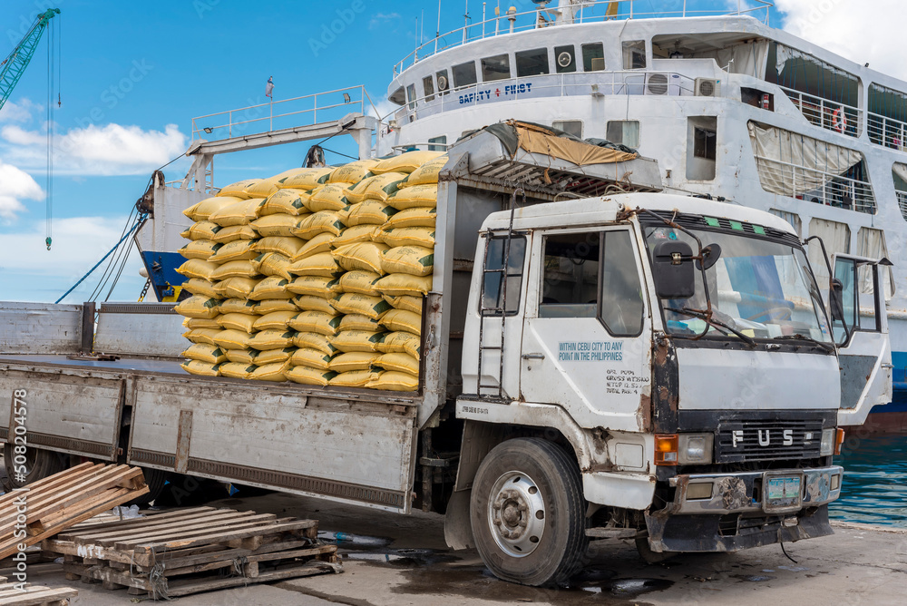 Cebu City, Philippines - May 2022: An open bed cargo truck laden with ...