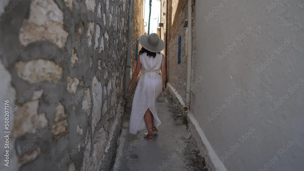 Video Stock Back view young curios Caucasian woman walking away on ...