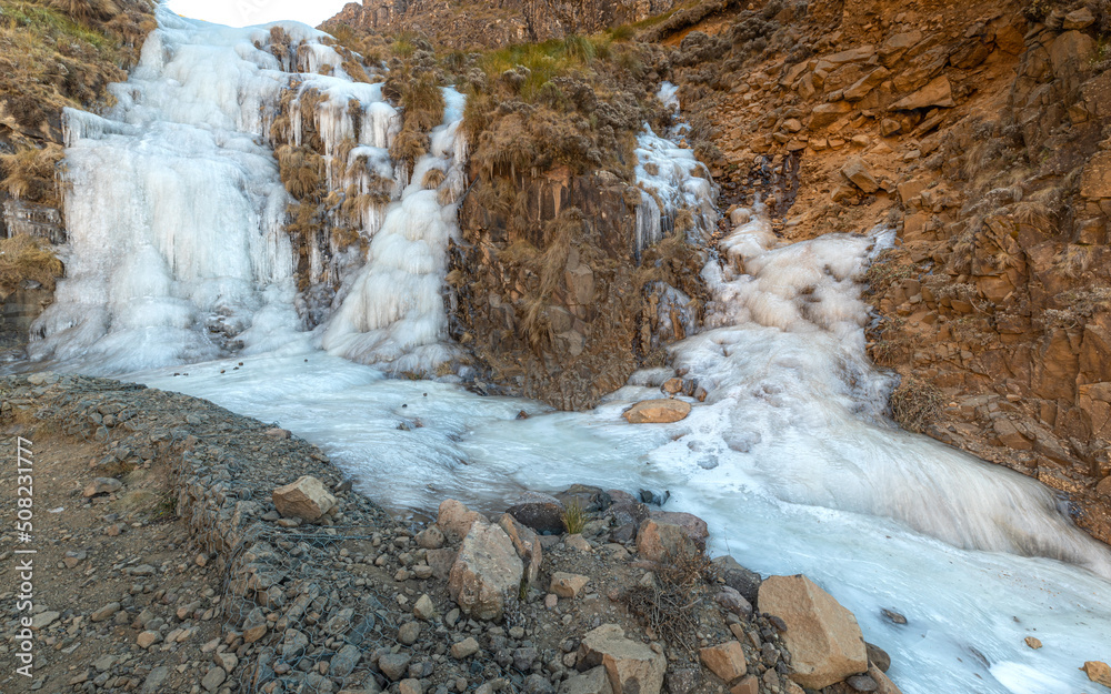 Mountain waterfall frozen at the Sani Pass, Drakensberg Mountains in ...