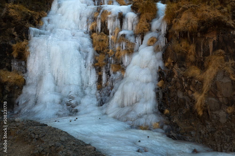 Mountain waterfall frozen at the Sani Pass, Drakensberg Mountains in ...