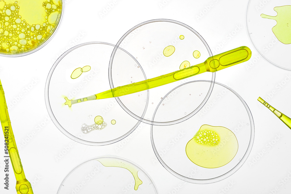 Liquid yellow samples in laboratory glassware on white background Stock ...