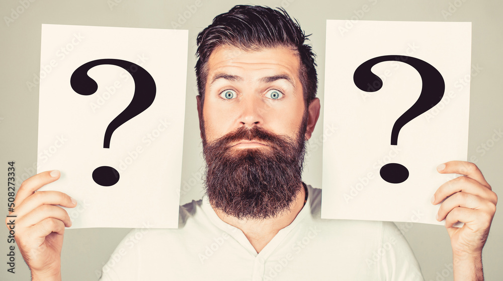 Man with question mark. Paper notes with question marks. Beard man ...