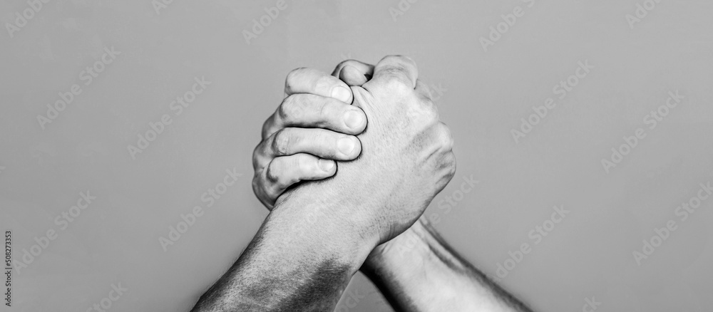 Two men arm wrestling. Arms wrestling. Closep up. Friendly handshake ...